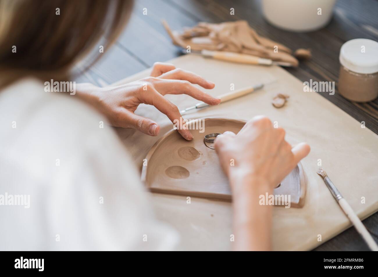 Woman decorating plate handmade hi-res stock photography and images - Alamy