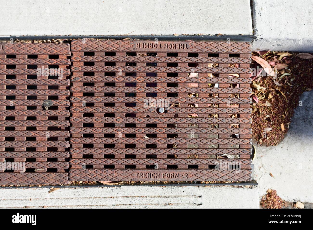 Trench Former drain system grate installed over void in concrete ...