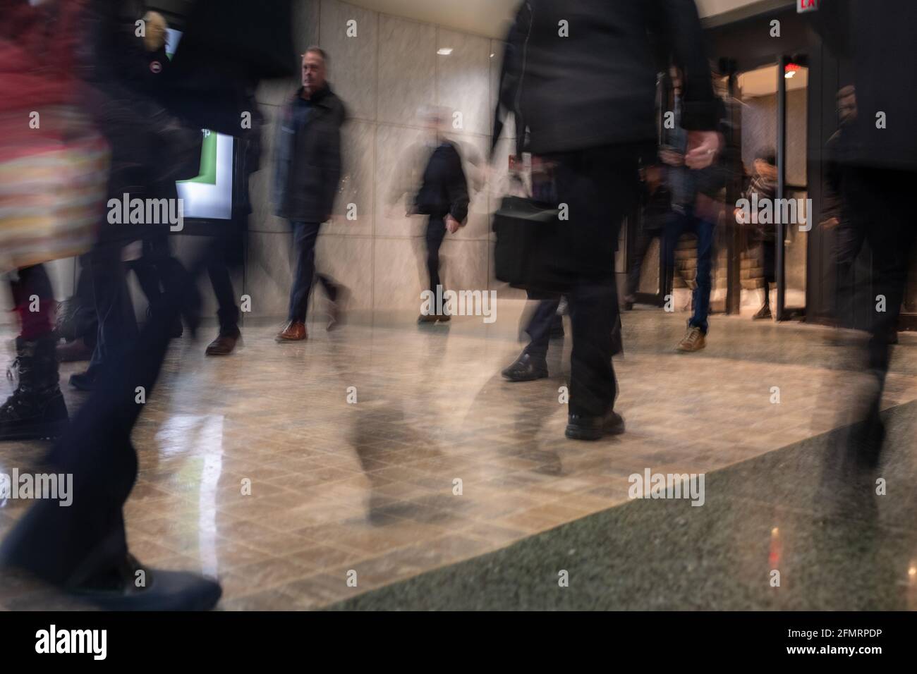 Workers walk in Toronto's underground PATH Stock Photo - Alamy