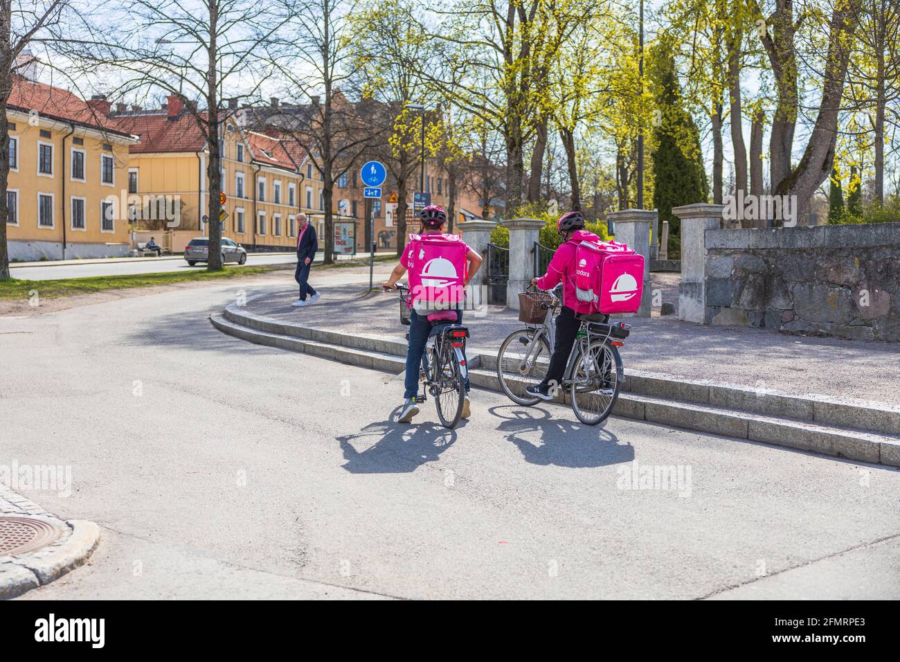 Beautiful colorful view of fast food delivery staff on sunny day ...