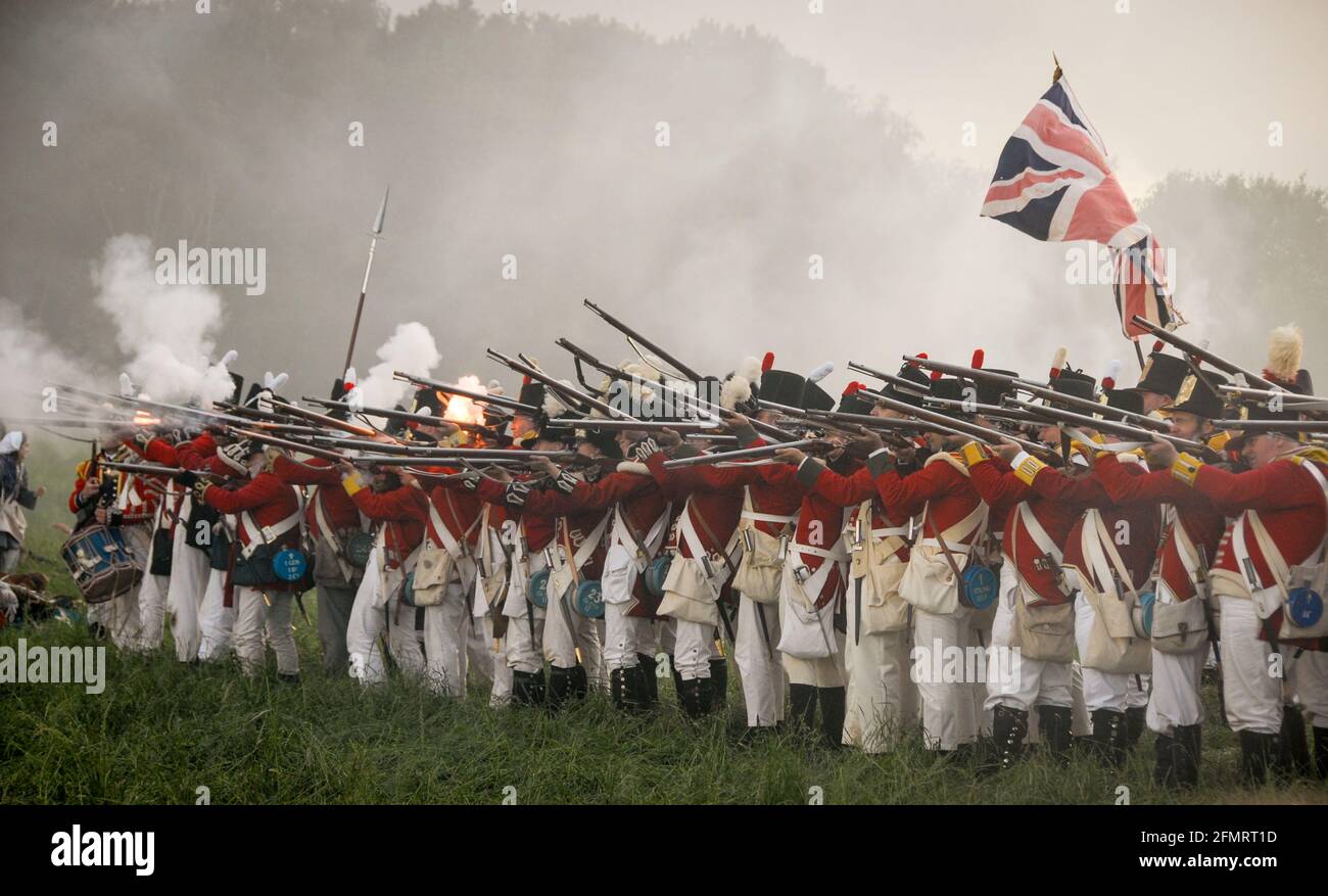 Fire! British infantry standing in line firing at the enemy during the ...