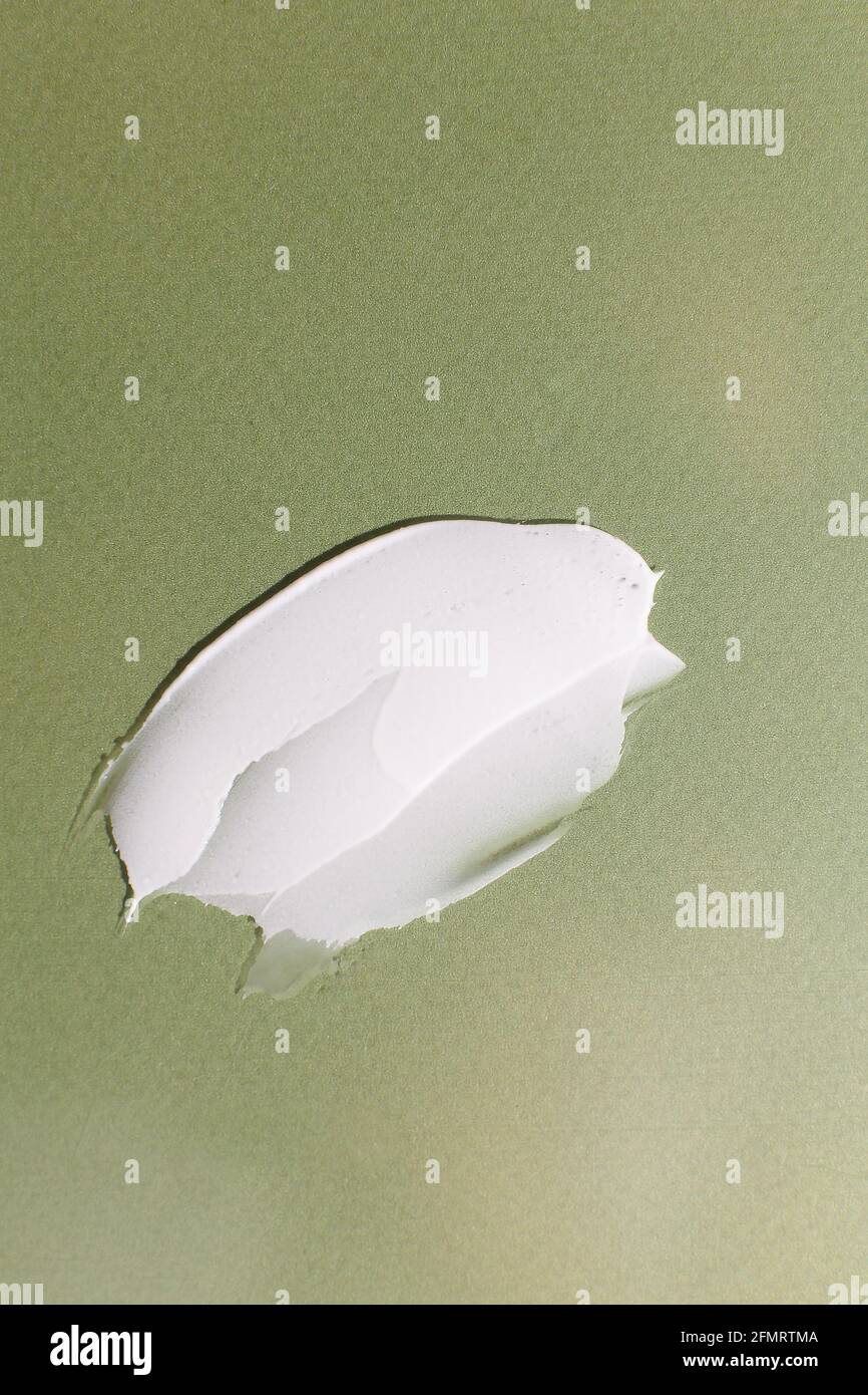 Cosmetic cream texture green background Stock Photo - Alamy