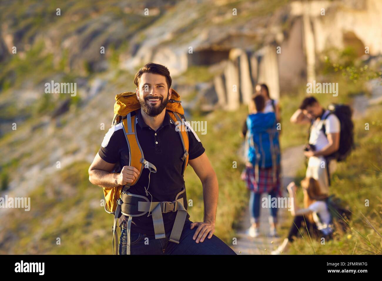 Happy group tour guide leader hi-res stock photography and images - Alamy