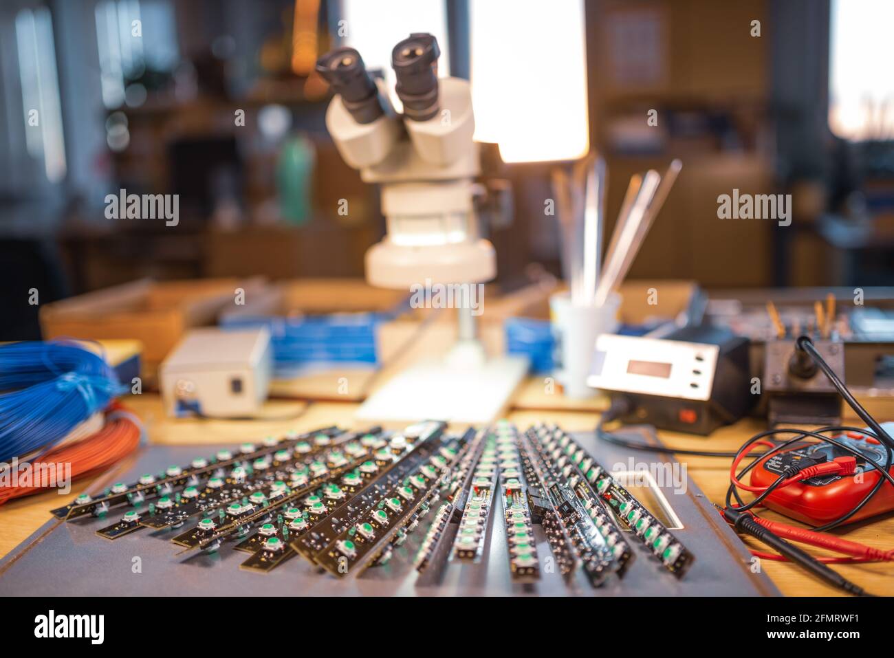 Large electron microscope and panel of LED light indicators are stacked ...