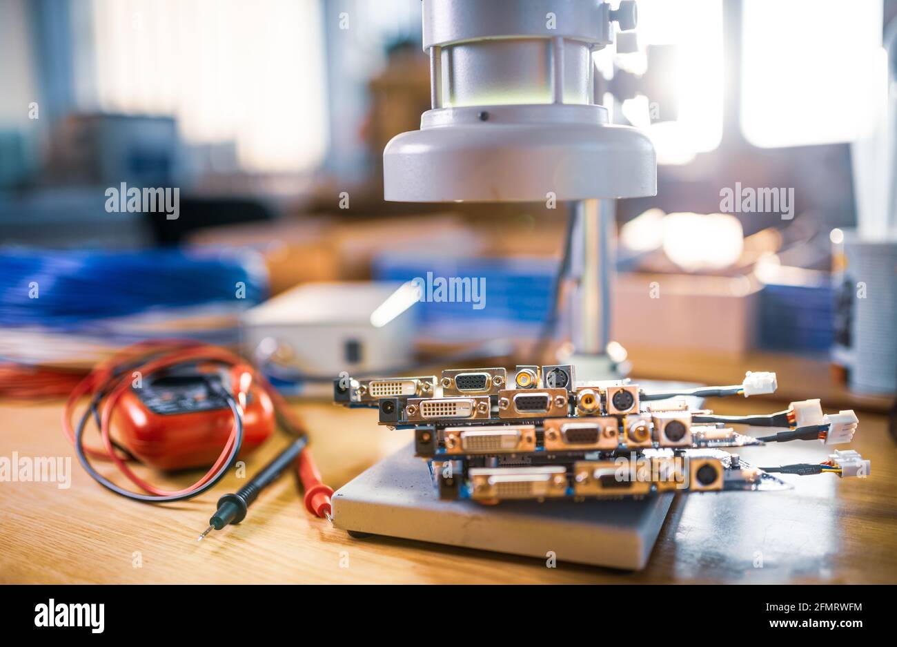 Large modern electron microscope and embedded microcircuits are stacked ...