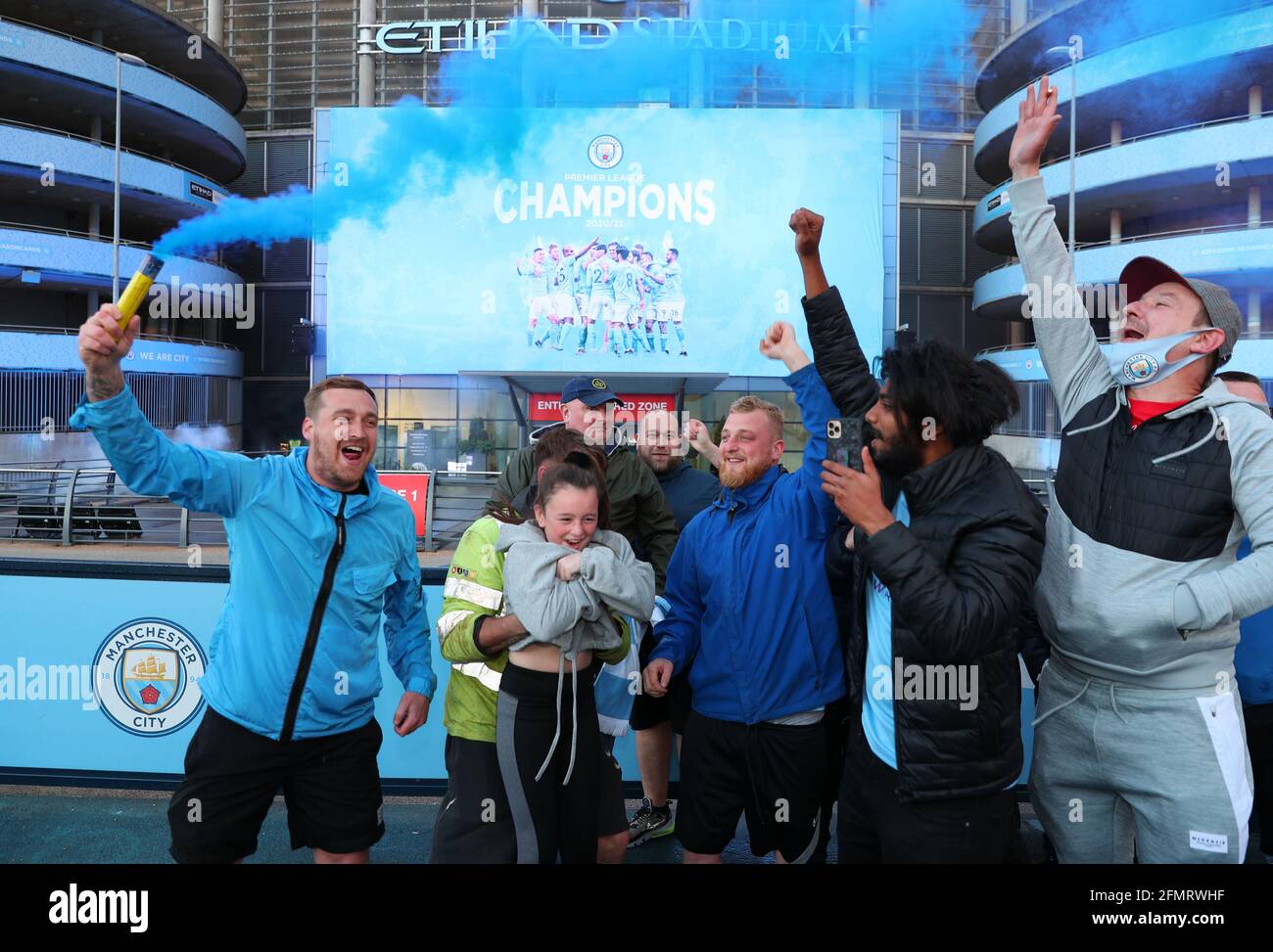 Manchester City fans celebrate at the Etihad Stadium, after Manchester ...