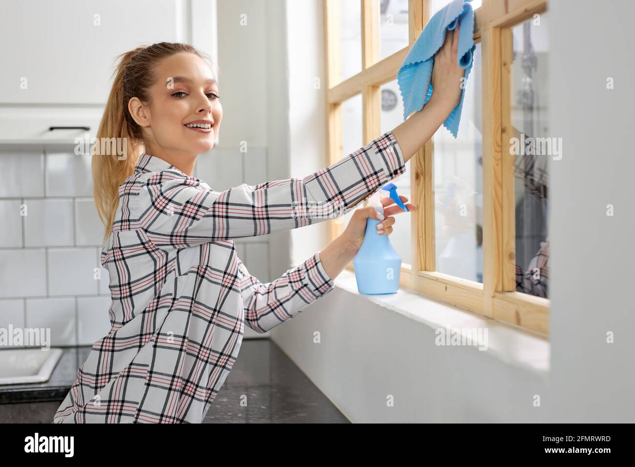 Smiling Woman Washing Window with Sponge Rag, Cleaning Window, Wiping ...