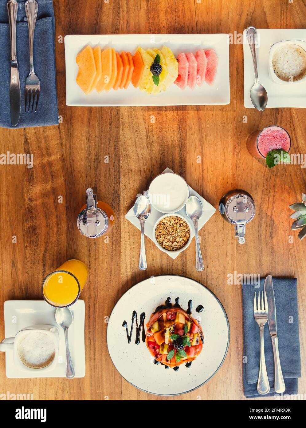 Top view of breakfast table with pancakes and fruits Stock Photo - Alamy