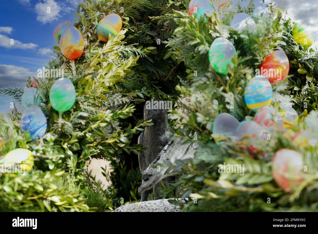 Easter is a religious festival with colored eggs and decorated bushes ...