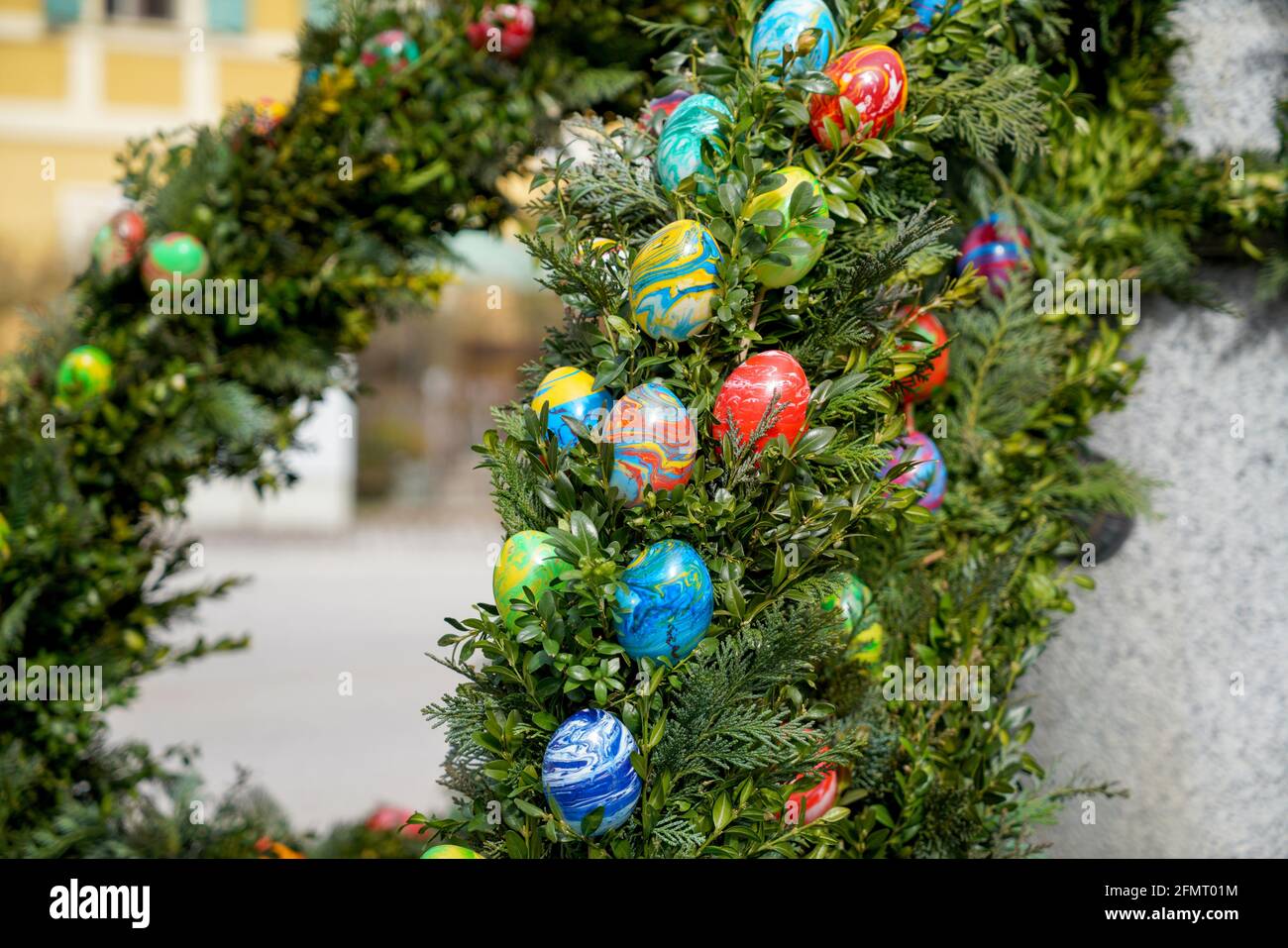 Easter is a religious festival with colored eggs and decorated bushes ...