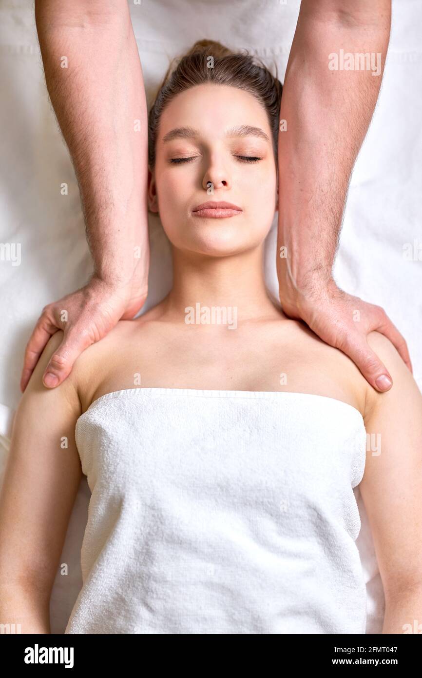 Relaxing Massage. Top view Woman Receiving Shoulders And Neck Massage At Spa Salon, Female Lying ...