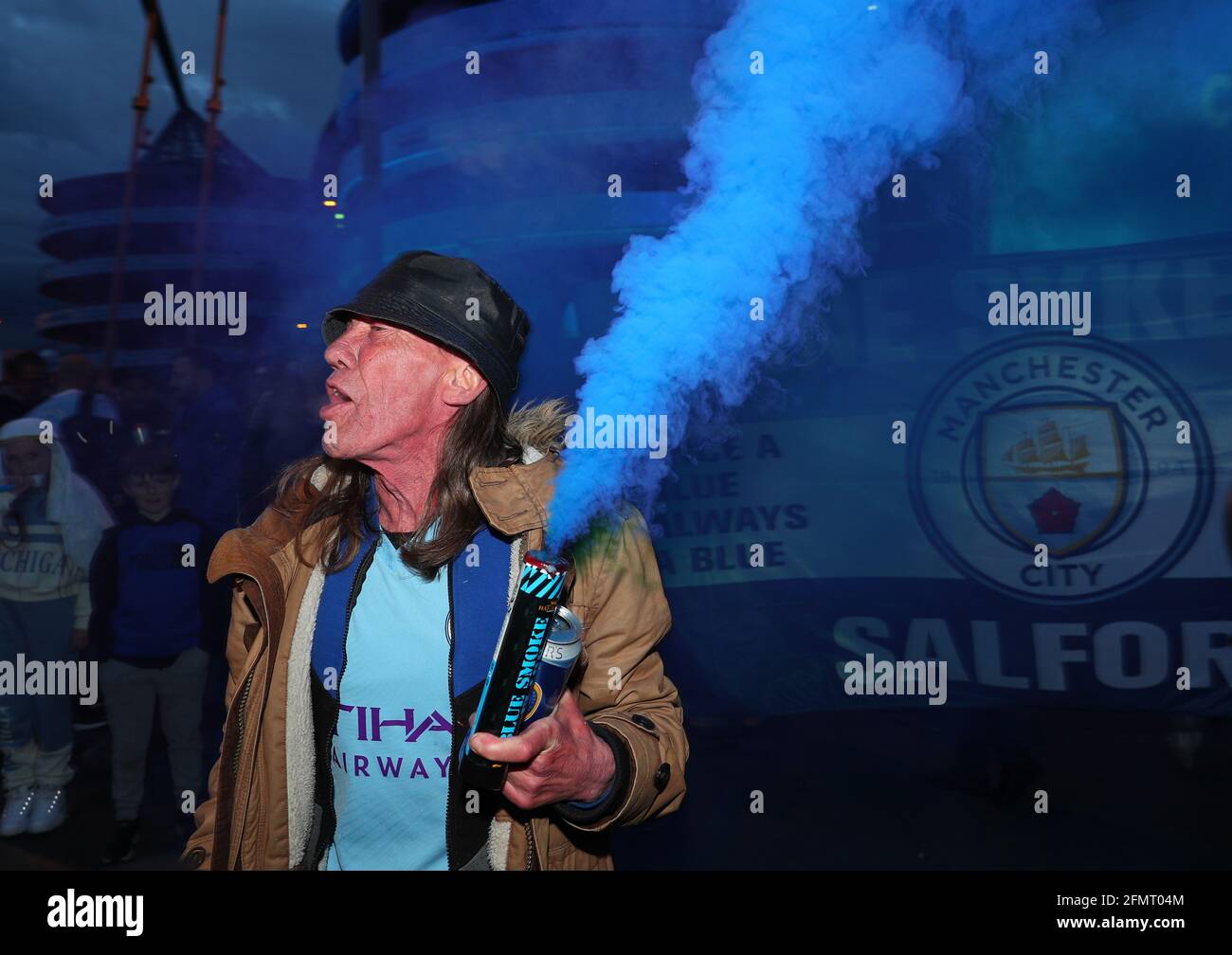 Manchester City fans celebrate at the Etihad Stadium, after Manchester ...