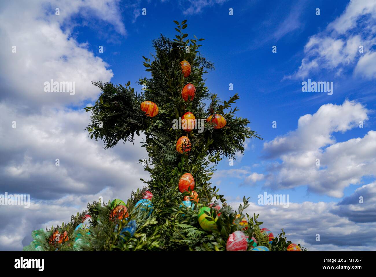 Easter is a religious festival with colored eggs and decorated bushes ...