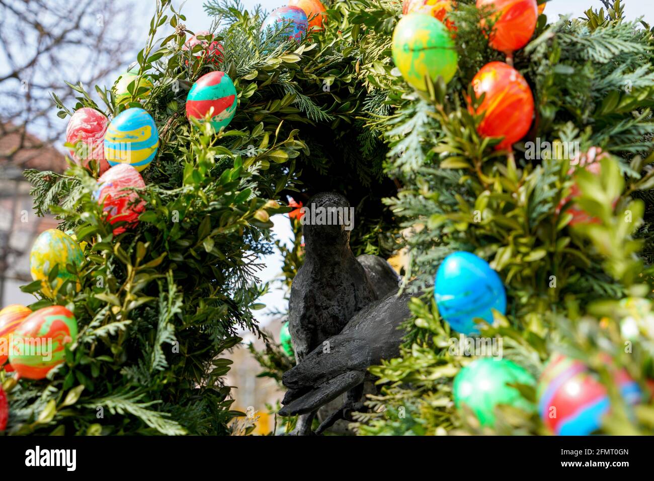 Easter is a religious festival with colored eggs and decorated bushes ...