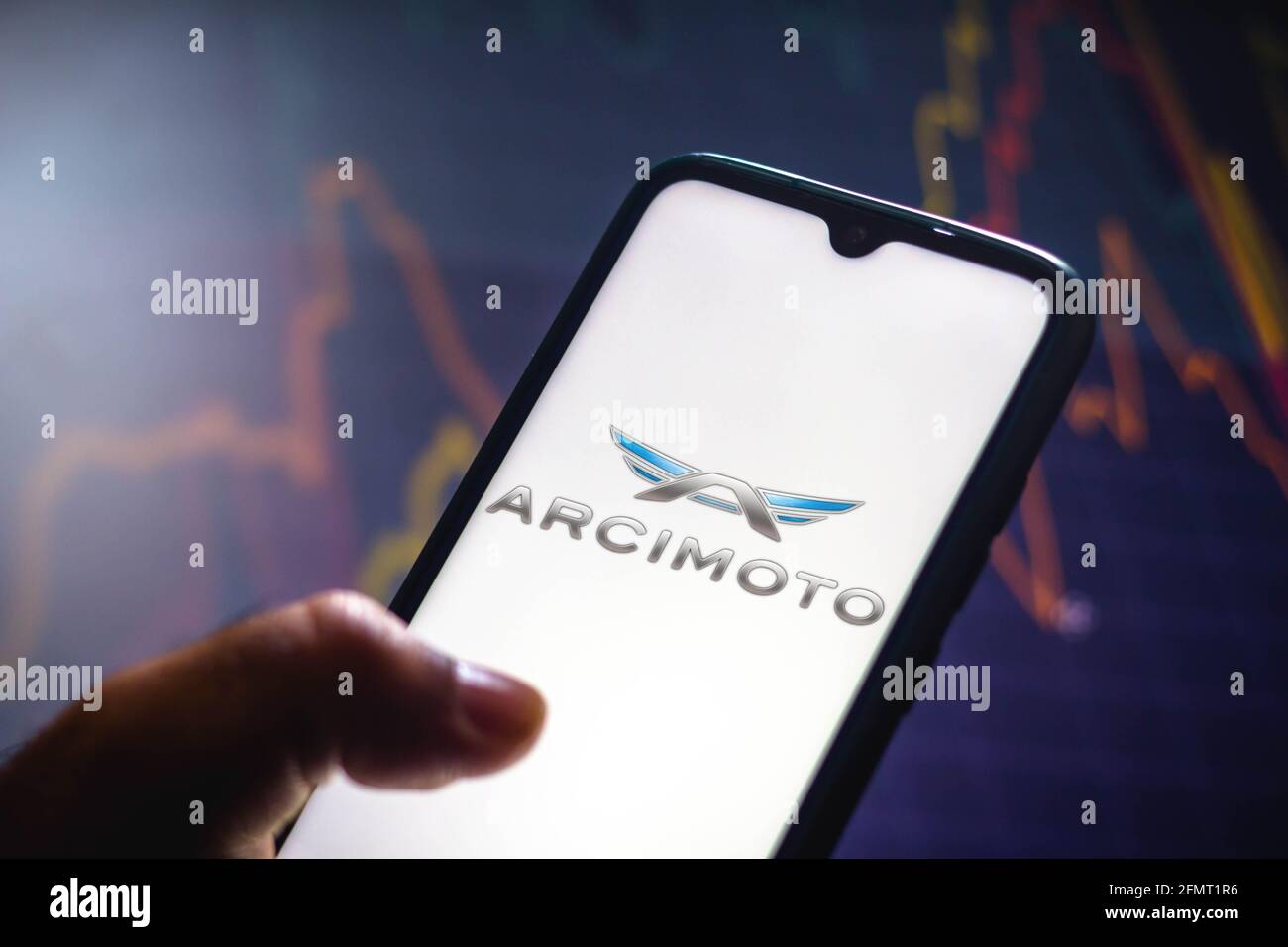 In this photo illustration the Arcimoto logo seen displayed on a ...
