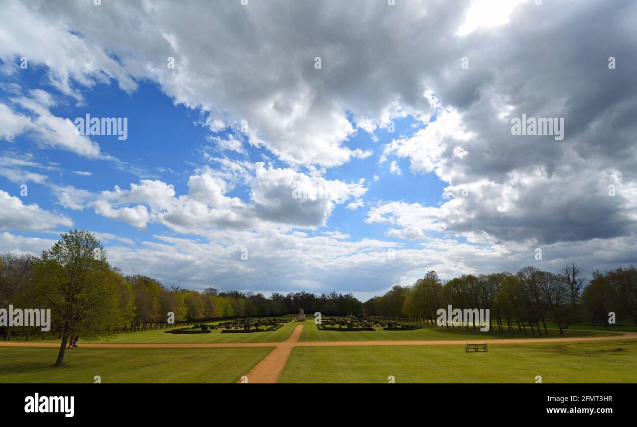 Clouds, blue sky and formal gardens background Stock Photo - Alamy
