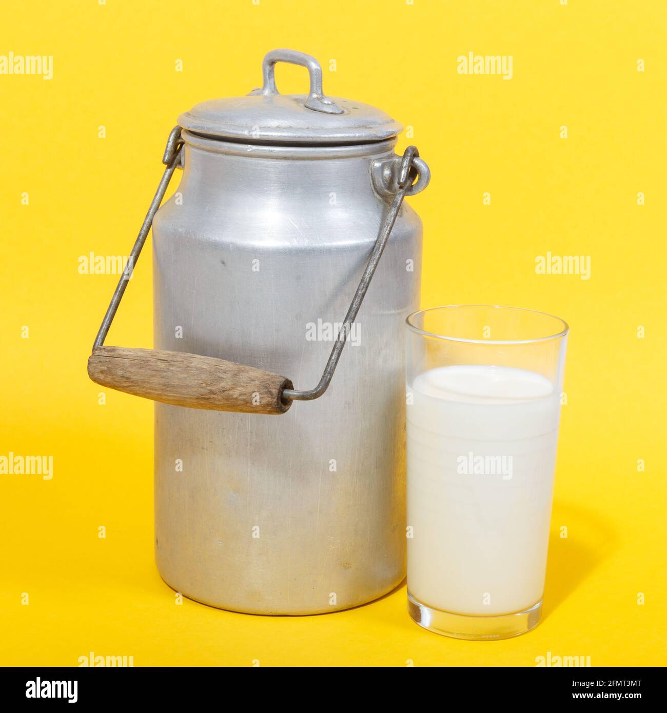 Old Milk Canister and glass Stock Photo - Alamy