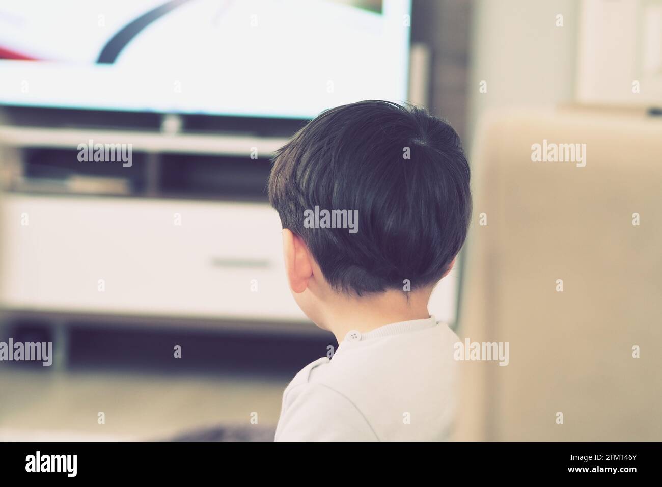 a child watching television, television and cartoon addiction, a child ...