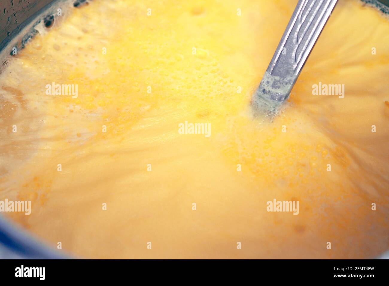 The cream layer formed on the cooked milk Stock Photo - Alamy