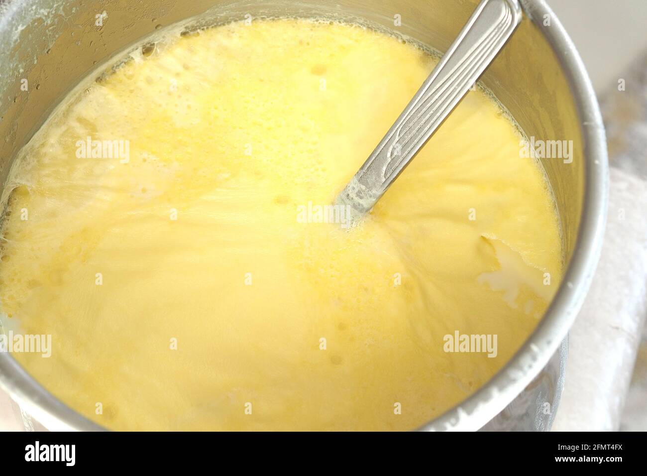 The cream layer formed on the cooked milk Stock Photo - Alamy