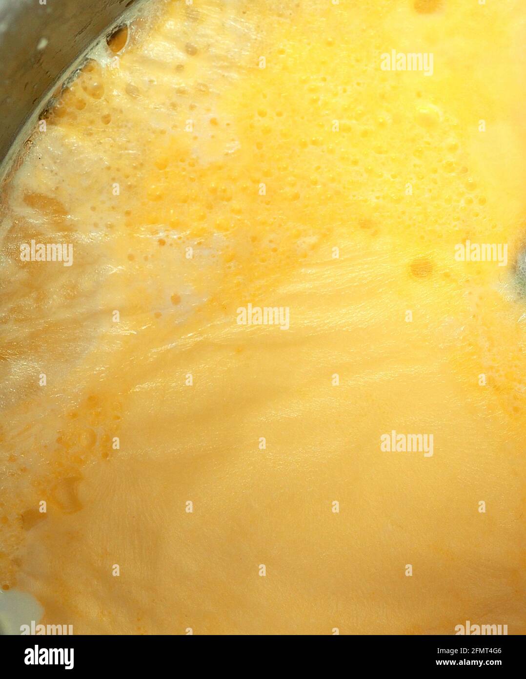 A layer of cream on milk and milk cooked in a pot, milk fat Stock Photo ...