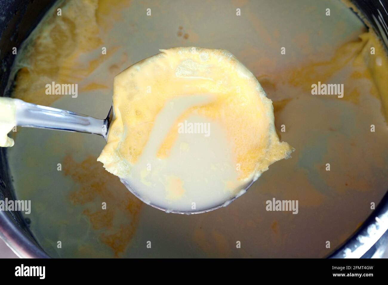 The cream layer formed on the cooked milk Stock Photo - Alamy
