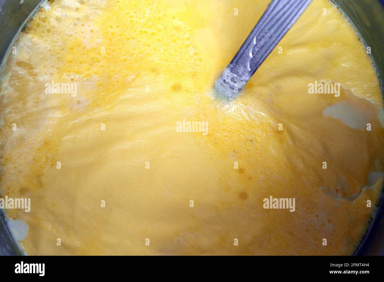 The cream layer formed on the cooked milk Stock Photo - Alamy