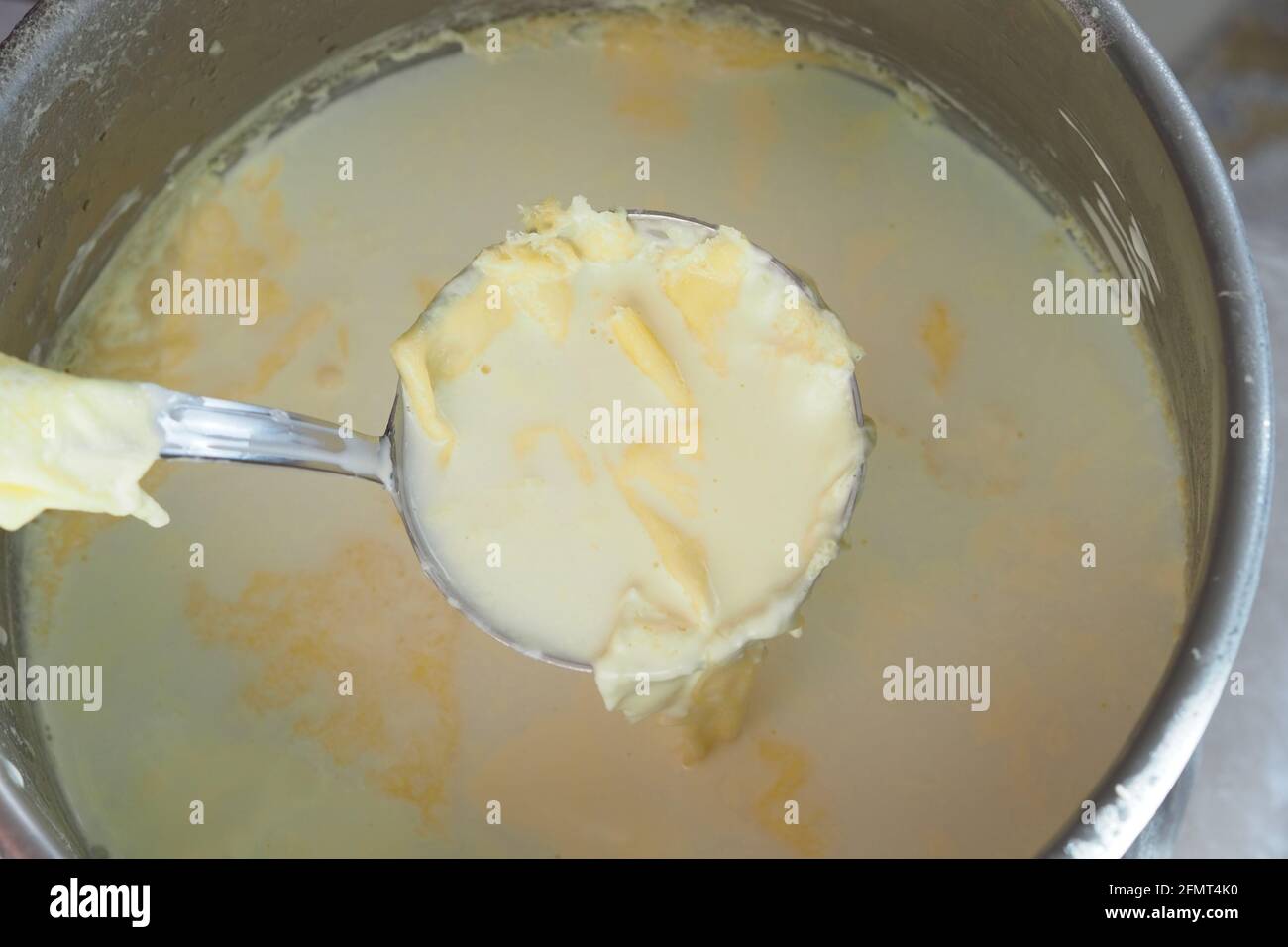 The cream layer formed on the cooked milk Stock Photo - Alamy