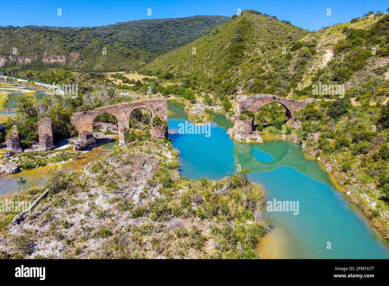 Medieval Roncal bridge of Yesa, which crosses the Aragon river Spain ...