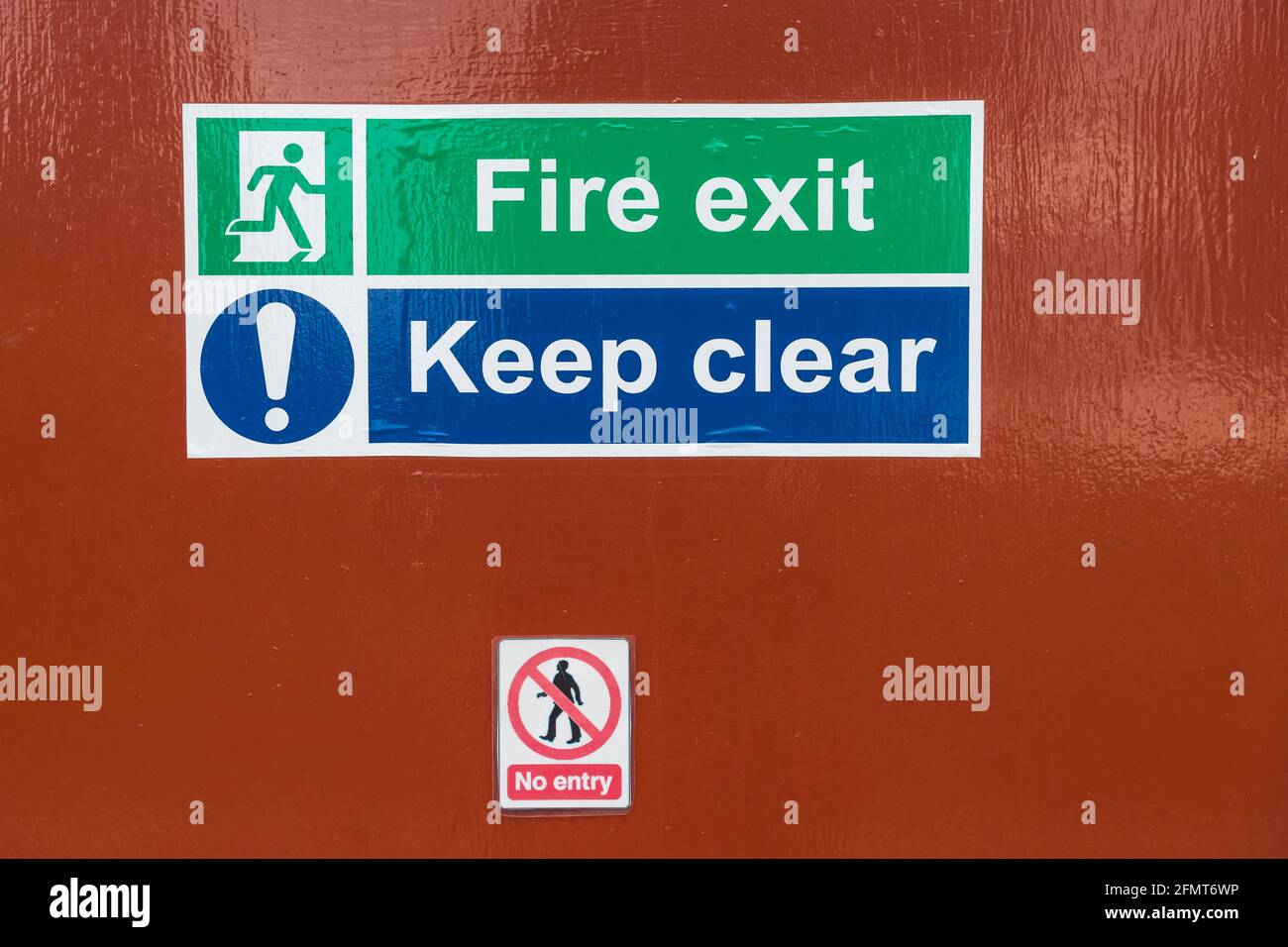 fire exit sign on a industrial door Stock Photo - Alamy