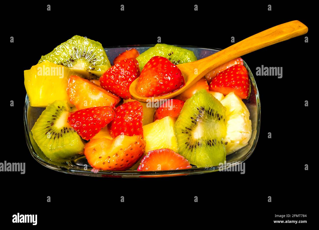 fresh fruit macedonia cut into cubes, Isolated background in black with ...