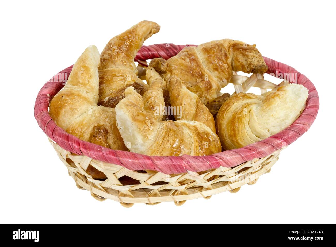 Buns, croissants, bread sticks in a wicker basket isolated on white ...