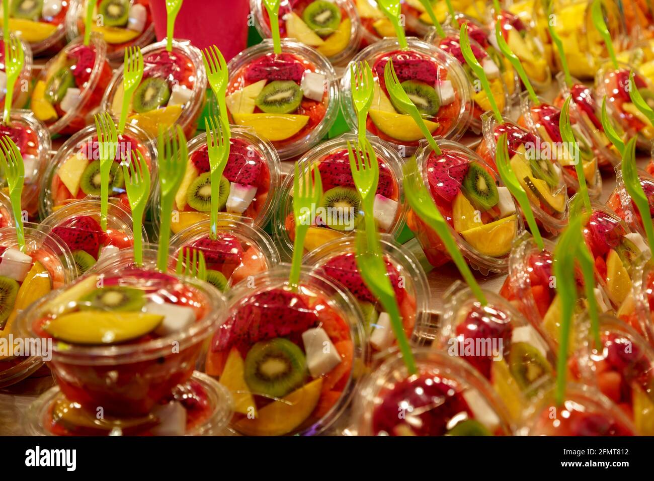 Cut fruit to eat with a fork in the Boqueria market Barcelona Spain ...