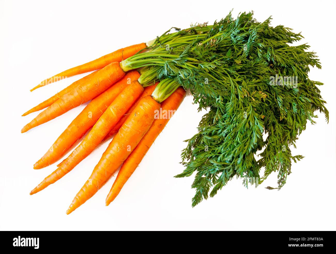 Fresh carrots isolated on white Stock Photo - Alamy