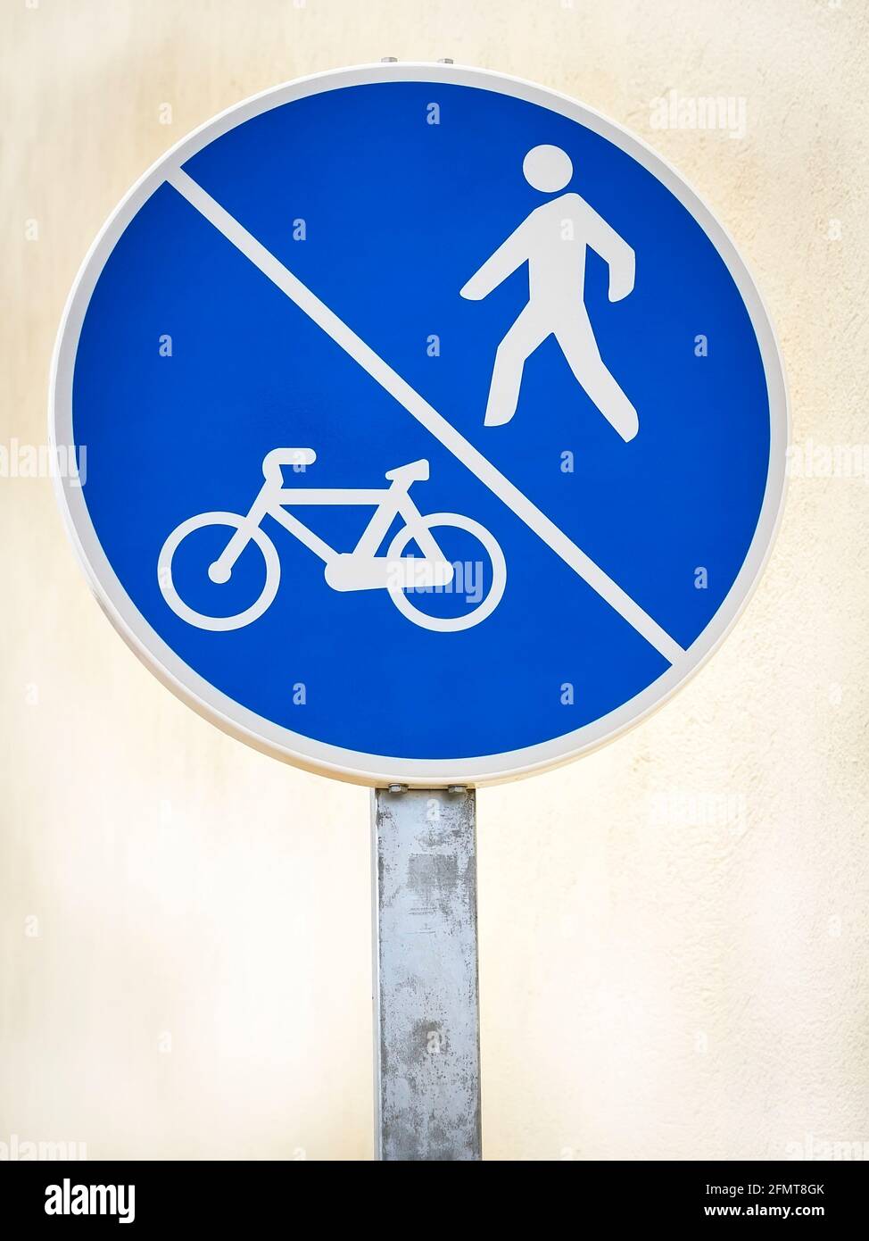 Bicycle and pedestrian lane road sign on pole post, large blue round ...