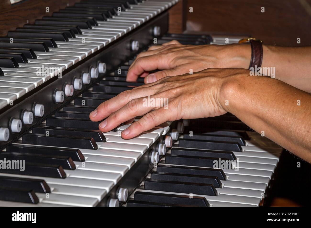 Musician playing on keyboards Stock Photo - Alamy