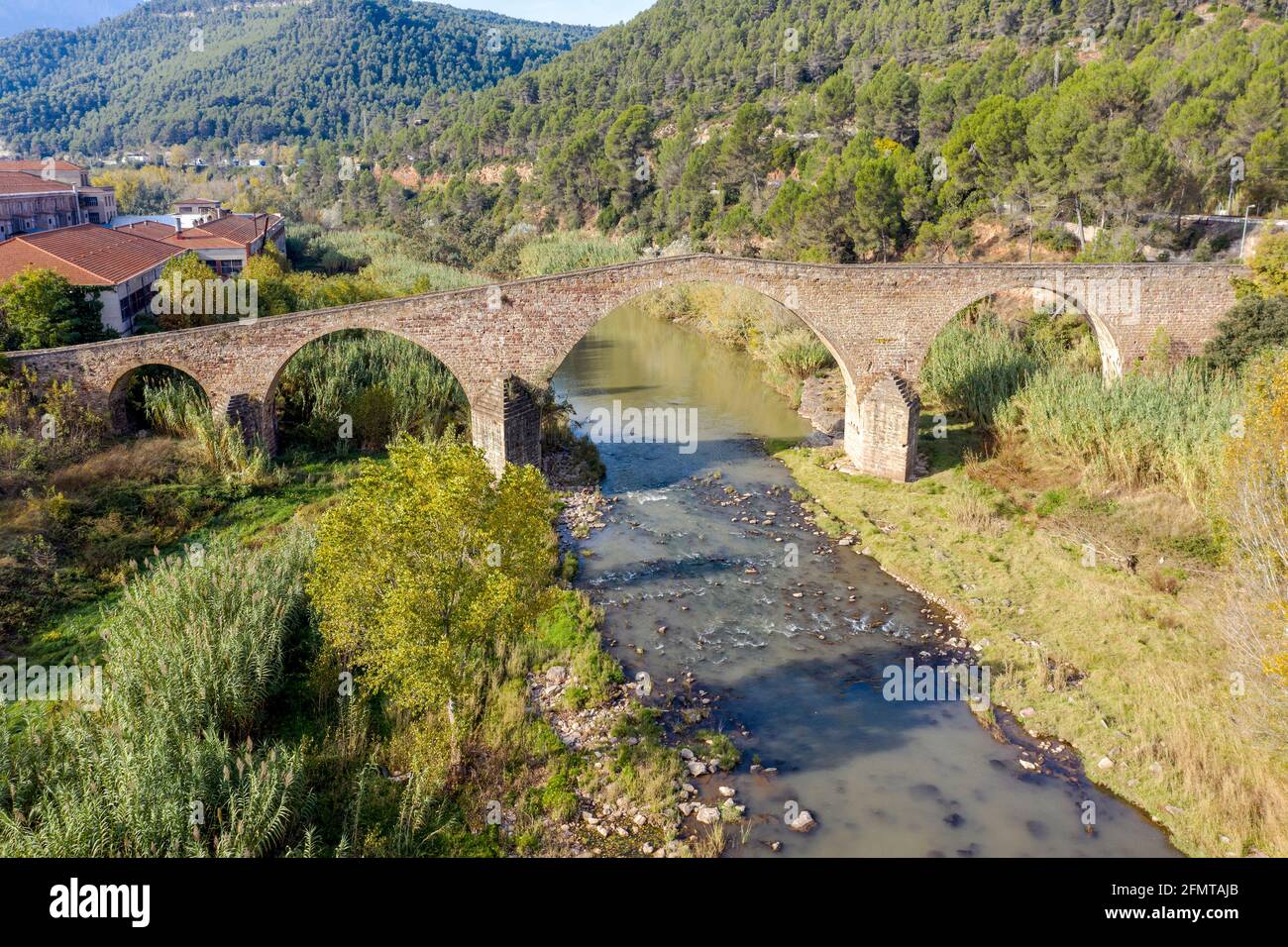 Castellbell and El Vilar old bridge over the Llobregat river. Northern ...