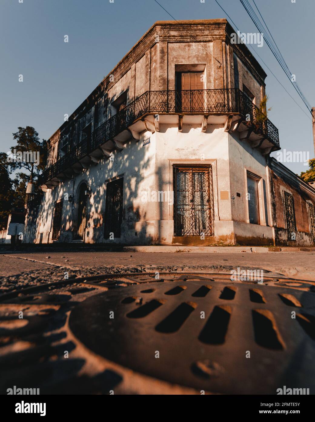 Vertical low angle shot of an old house corner during a golden hour in ...