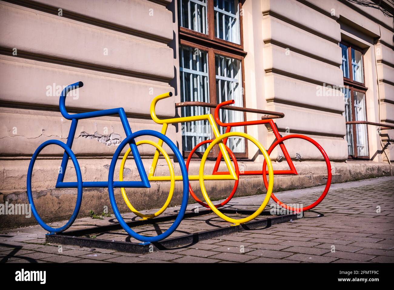 Colorful bicycle rack on the pavement Stock Photo - Alamy