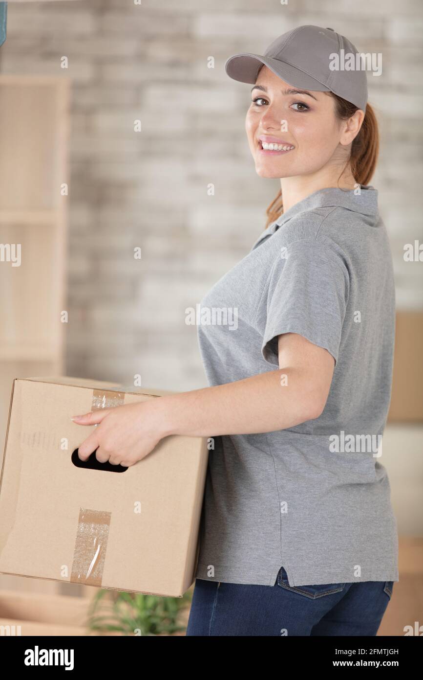 Woman carrying a box hi-res stock photography and images - Alamy