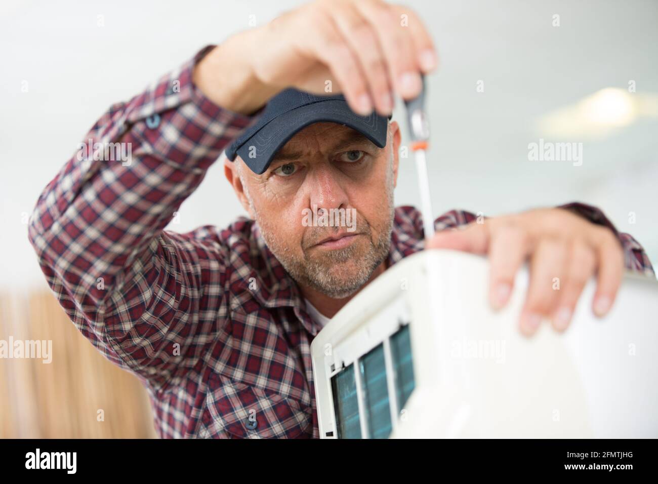 Male technician fixing electric hi-res stock photography and images - Alamy
