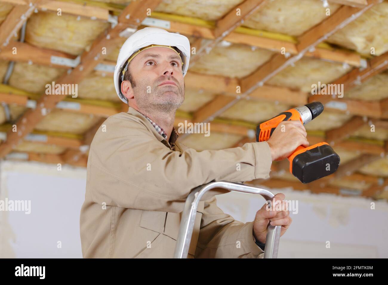 worker using a cordless drill Stock Photo - Alamy