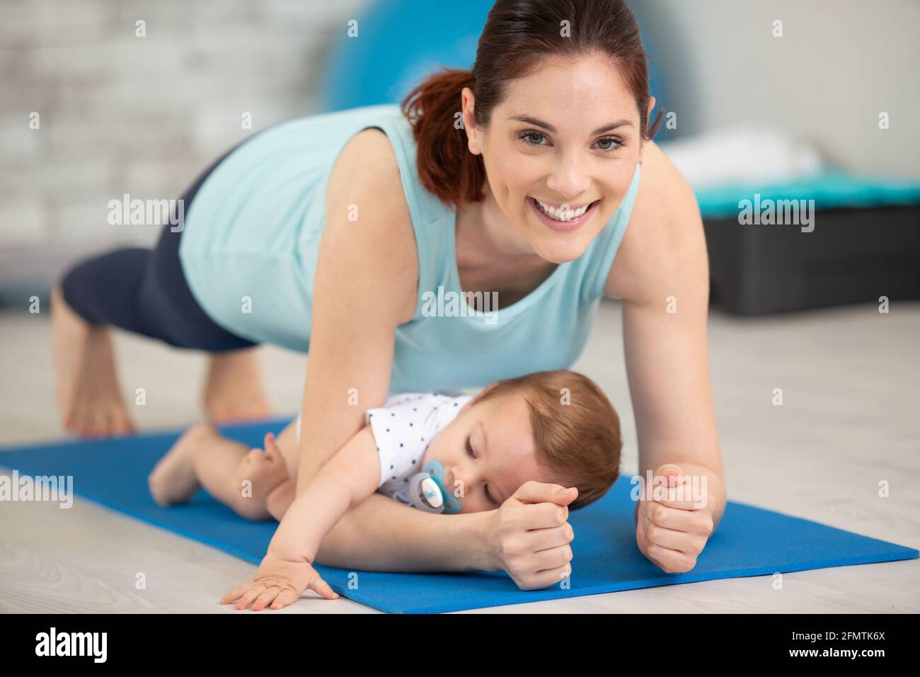 Mum with baby yoga hi-res stock photography and images - Alamy