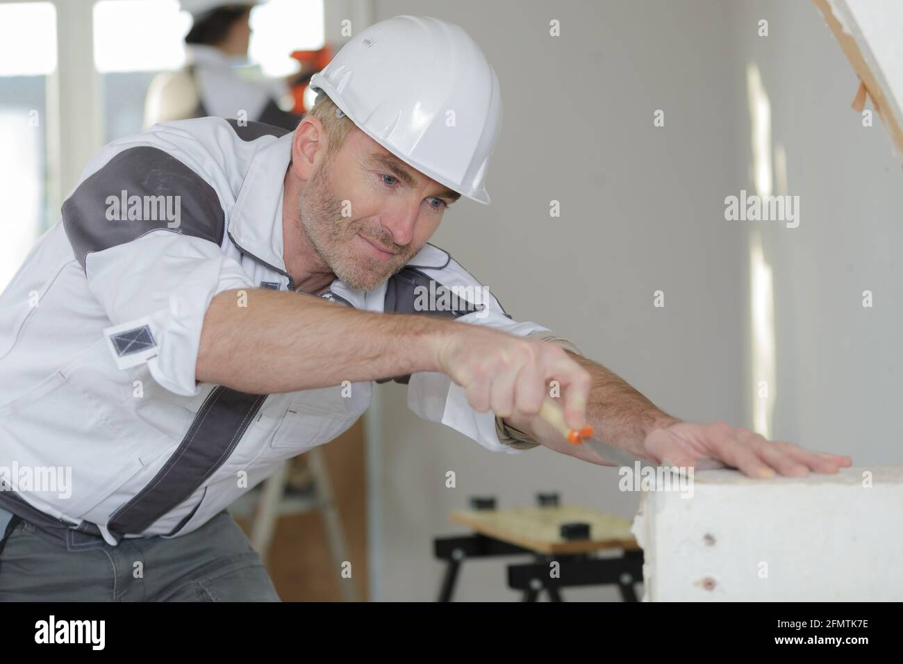worker with helmet working indoors Stock Photo - Alamy