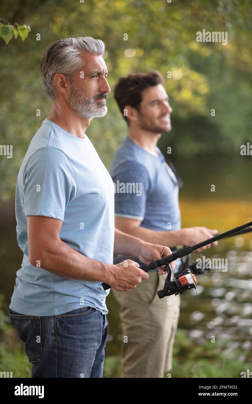 Two pole fishermen hi-res stock photography and images - Alamy