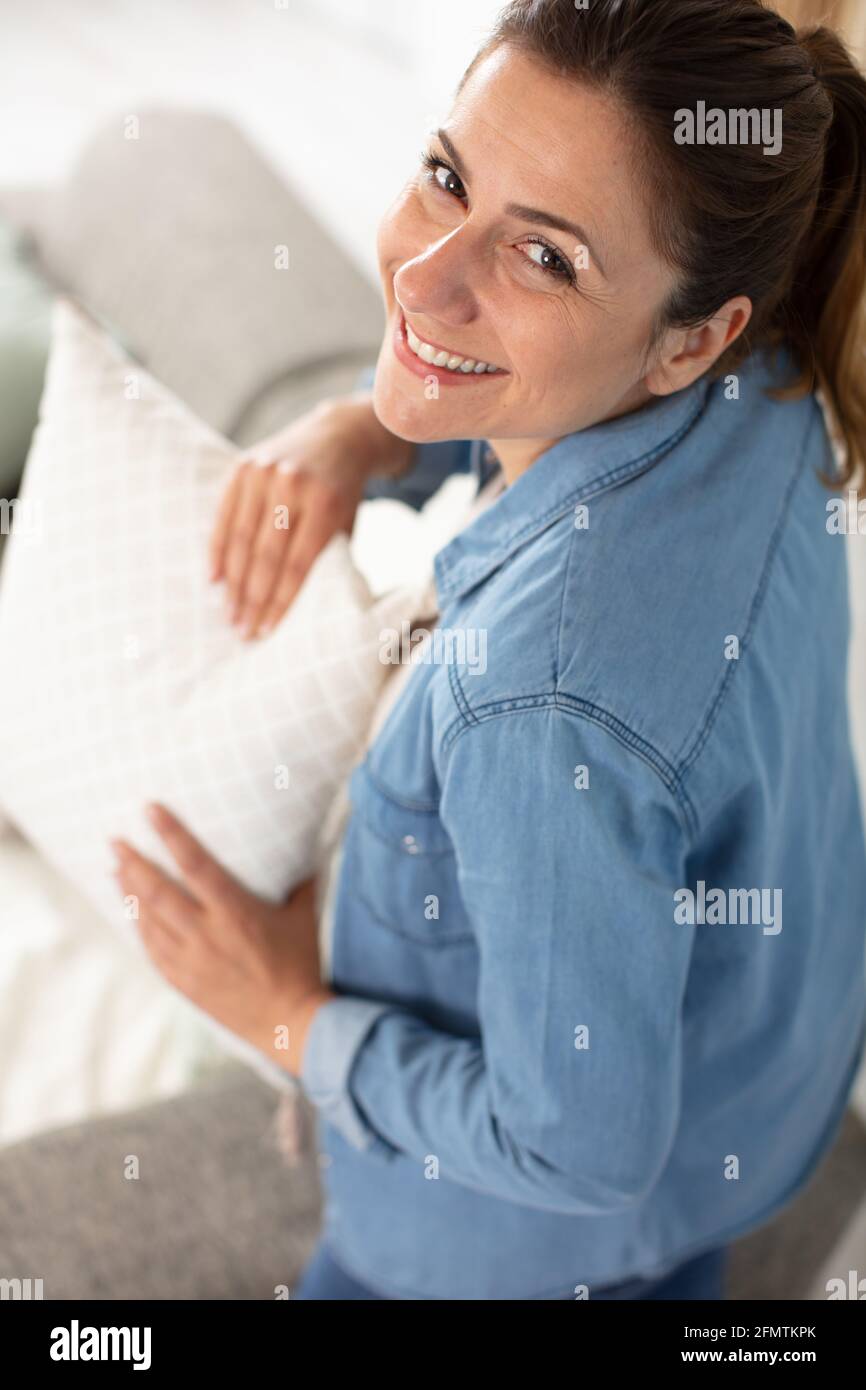 beautiful female housekeeper working in room Stock Photo - Alamy