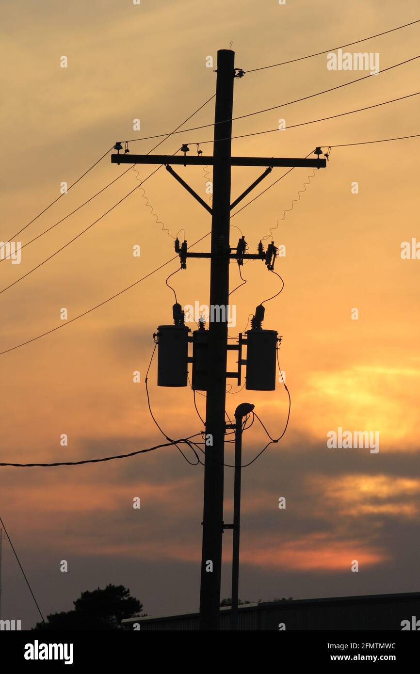 Power Lines at Sunset with a colorful Sky out in the country Stock ...