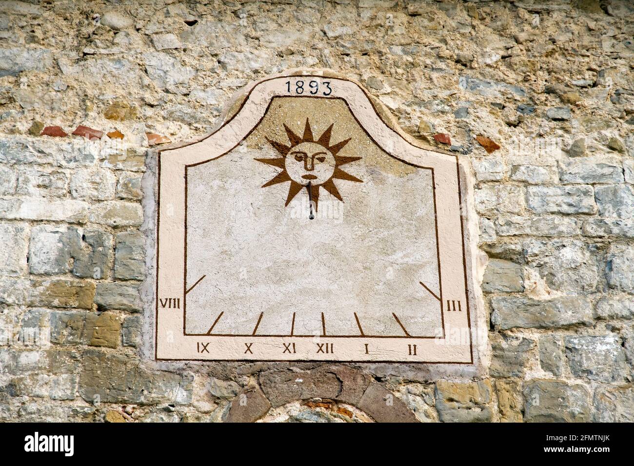 sundial old rustic wall of a Spanish village Stock Photo - Alamy