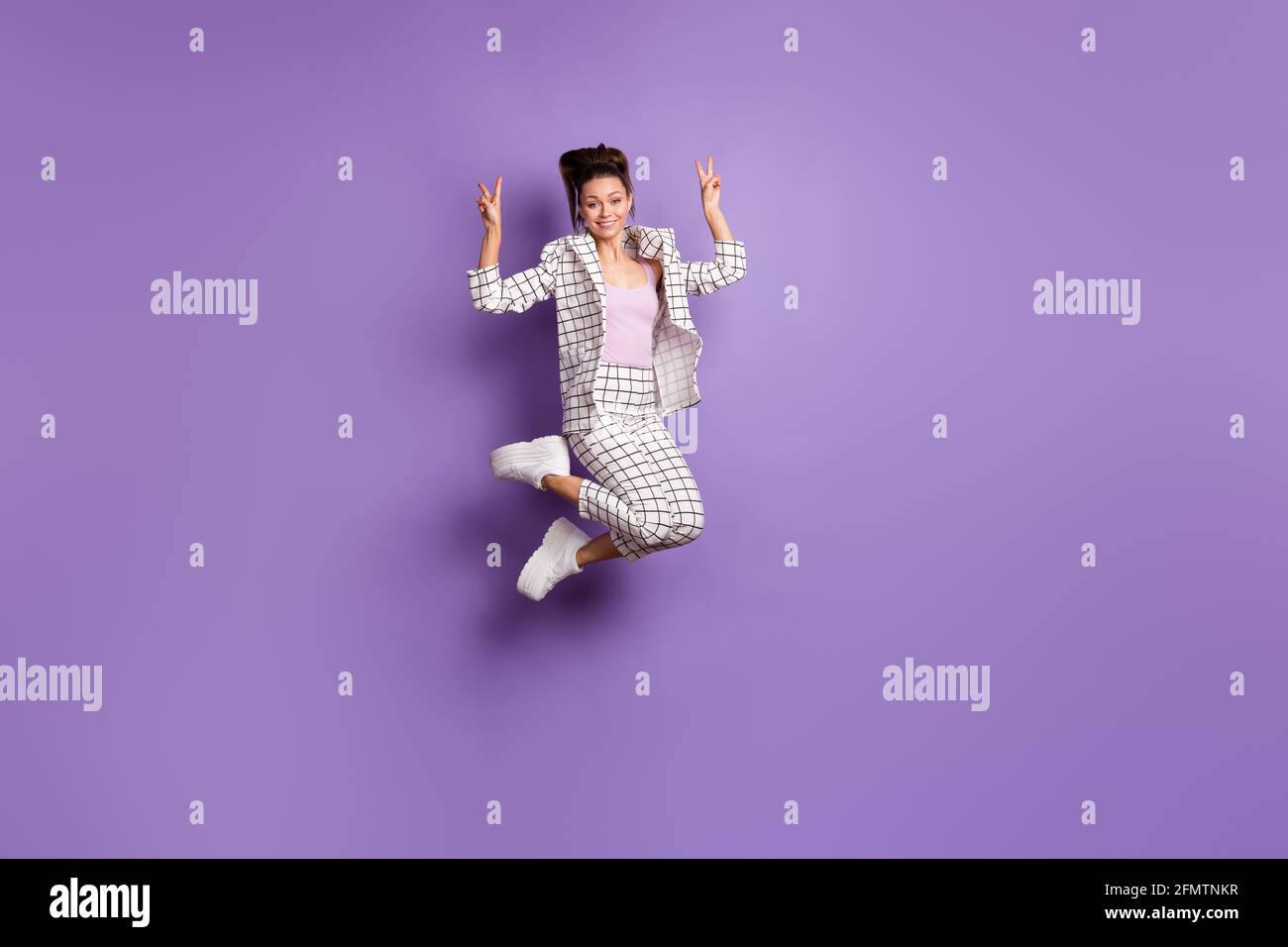 Full length photo of young girl happy positive smile jump show peace ...