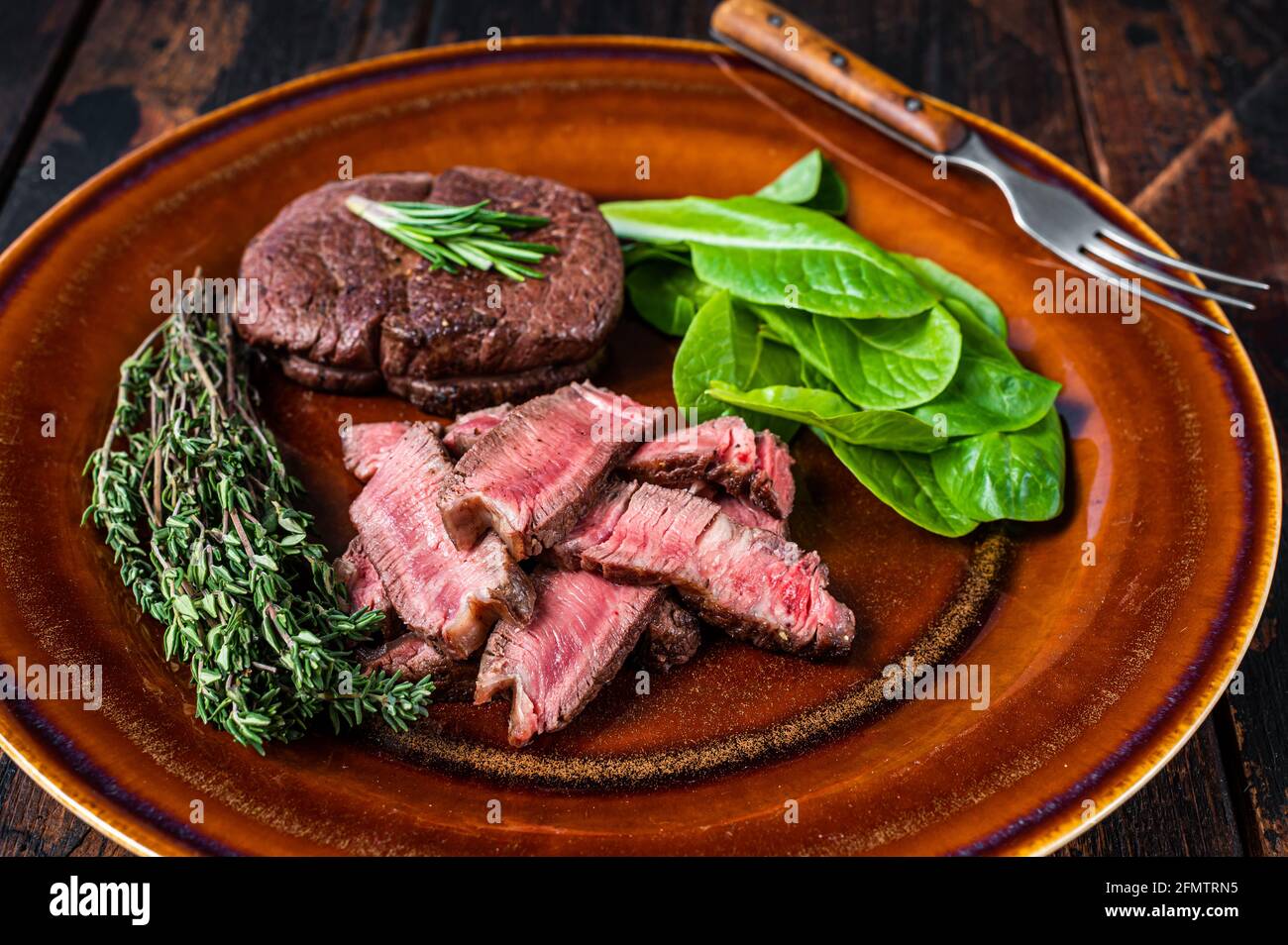 Fillet Mignon tenderloin roast and cut meat beef steaks in a plate with ...